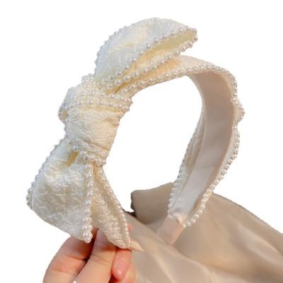 China Luxury Crystal Pearl Knot Headband for Women Baroque Wedding Designer Hair Accessory for sale