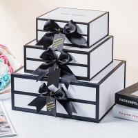 China Rigid White Magnetic Cardboard Gift Boxes With Black Rim And Ribbon Bow for sale