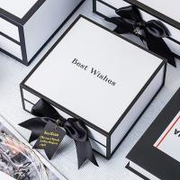China Rigid White Magnetic Cardboard Gift Boxes With Black Rim And Ribbon Bow for sale