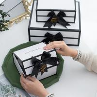 China Rigid White Magnetic Cardboard Gift Boxes With Black Rim And Ribbon Bow for sale