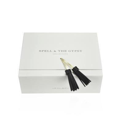 China Hidden Magnet Collapsible Rigid Paper Gift Box Book Shape With Tassels Strap for sale