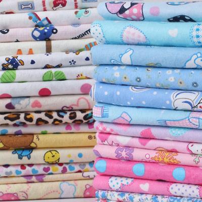 China 100% Cotton Face Printed Coral Fleece Fabric Pajama Toys Plush Toy Fabric Shrink-Resistant Double Flannel Fabric Skin-Friendly for sale