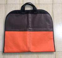 China Handle Suit Garment Bag Travel Colored Non Woven Printed With Clips 115*60 cm Size for sale