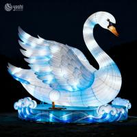 China Custom Large White‑Blue Swan Zigong Lantern, LED Water Bird Light Sculpture with Wave Base for Outdoor Night Festival for sale