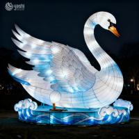 China Custom Large White‑Blue Swan Zigong Lantern, LED Water Bird Light Sculpture with Wave Base for Outdoor Night Festival for sale