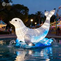 China Custom Sea Lion Lantern, Large Floating LED Sea Lion Light Sculpture With Wave Base for Ocean‑Theme Park & Water Light Festival for sale