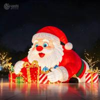 China Custom Giant Outdoor Santa Claus Head Festival Lantern With Christmas Tree Gift Box for Theme Park Night Tour & Holiday Party Decoration for sale