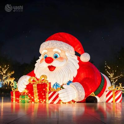 China Custom Large Outdoor Lying Santa Claus Festival Lantern with Gift Box LED Christmas Light for Park Zoo Holiday Decoration for sale