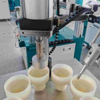China Industrial PLC Controlled Glue Dispensing Machine for E14 Base Riveting with 2500PCS/H Capacity for sale