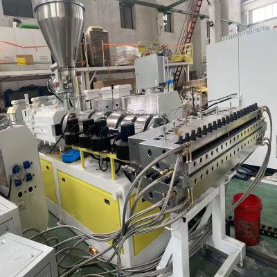 China Decorative WPC Door Extrusion Line Panel Vacuum Mix Plastic Sheet Extrusion Machine for sale