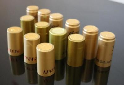 China Custom PVC Heat Shrink Caps for Wine Bottles with Tear Strip 75 Micron Thickness for sale