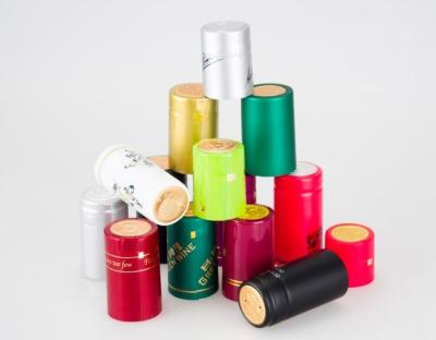 China Custom Colored PVC Heat Shrinkable Wine Bottle Capsules 30mm Diameter Side Offset Printed Hot Stamping for sale