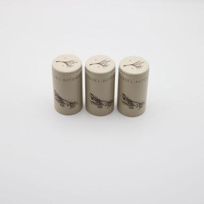 China Custom Top Embossed Logo Aluminum Plastic Wine Capsule Polylaminate for Liquor Bottle 30x50mm for sale