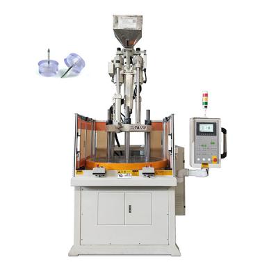 China Easy Operate Rotary Vertical Plastic Injection Molding Machine For Making Tack for sale