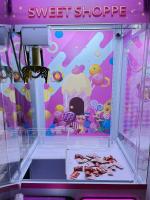 China Sweet Candy Claw Crane Coin Operated Arcade Game Machine for sale