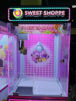 China Sweet Candy Claw Crane Coin Operated Arcade Game Machine for sale