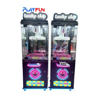 China Brazil Popular Arcade Clip Mini Game Machine Lucky Clip Prize Machine 24 Clips Coin Operated Machine for sale