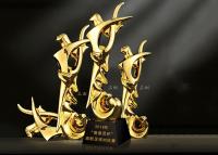 China Poly Resin Material Award Cups Trophies With Abstract Figure Design for sale