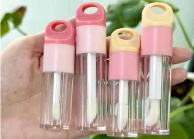China Keychain Hole Shape Cap 4ml 6ml Thick Round Lip Gloss Rod Tube Large Brush Lip Gloss Bottle for sale