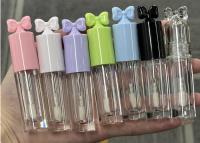 China Custom logo clear 2.5ml Bow Cover Lip Gloss Tube Packaging For Makeup for sale