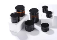 China Round Cosmetic Container Refillable Empty Mini Eye Cream Face Cream Amber Glass Jar With Black Lids for sale