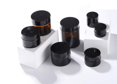 China Round Cosmetic Container Refillable Empty Mini Eye Cream Face Cream Amber Glass Jar With Black Lids for sale