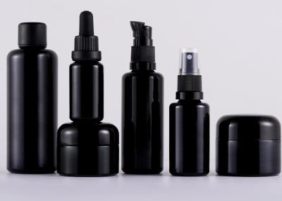 China Black Skin Care Packaging Cream Bottle Glass Skincare Packaging Cream Cosmetic Glass Jar and Lotion Bottle Set for sale