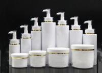 China 100ml 150ml 200ml 250ml 300ml 350ml 400ml 500ml White Pump Bottle with Gold Silver Line Cap for sale