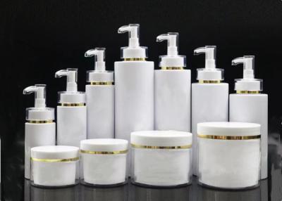 China 100ml 150ml 200ml 250ml 300ml 350ml 400ml 500ml White Pump Bottle with Gold Silver Line Cap for sale