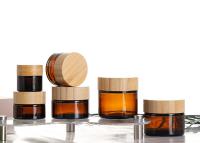 China 10g 30g 50g 100g Cosmetic Bamboo Lid Glass Jars 50g Face Cream Amber Glass Jar with Bamboo Lid for sale