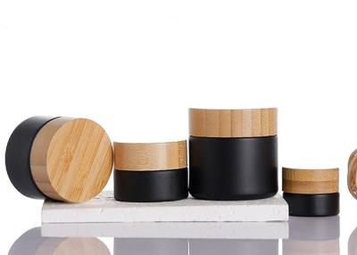 China 15g 20g 30ml 50g 100ml Clear Black Amber Green Cosmetic Body Butter Cream Glass Jar With Bamboo Lid for sale