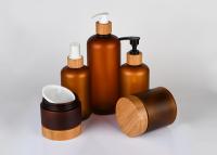 China Bamboo Lid Empty Facial Cream Pump Lotion Jars Containers Cosmetic Packing Set Amber PET Plastic Bottle for sale