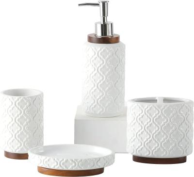 China Custom White Ceramic Bathroom Set 4 Piece Soap Dish Dispenser Toothbrush Holder Cup Hotel Decor for sale