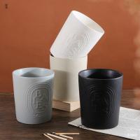 China Matte Embossed Empty Ceramic Candle Jar Multi Colored With Wooden Lids for sale