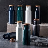 China Custom Color Ceramic Vinegar Oil Dispenser with Wooden Lid 1200℃ Porcelain for sale