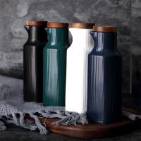 China Custom Color Ceramic Vinegar Oil Dispenser with Wooden Lid 1200℃ Porcelain for sale