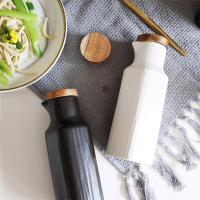 China Custom Color Ceramic Vinegar Oil Dispenser with Wooden Lid 1200℃ Porcelain for sale