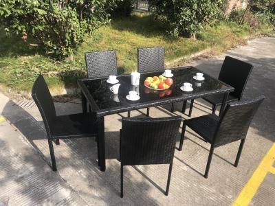 China Stackable Chair Outdoor Rattan Dining Set KD Tabke With Black Glass for sale