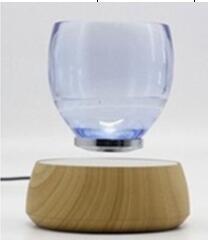 China 360 rotating magnetic floating bottom coffee cup water cup for sale
