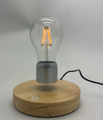 China round base wireless magnetic levitation desk lamp light night bulb for sale