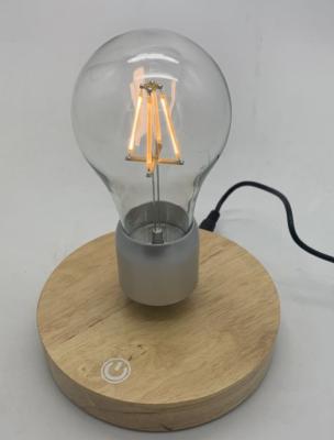 China round base wireless magnetic levitation desk lamp light night bulb for sale