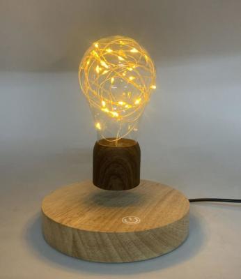 China round base wireless magnetic levitation desk lamp light night bulb for sale