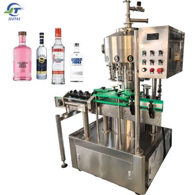 China Automatic Counter Pressure Filling Rotary Filler Machine for Grape Wine Bottling Machine with Liquid Canning for sale