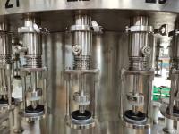 China Automatic Counter Pressure Filling Rotary Filler Machine for Grape Wine Bottling Machine with Liquid Canning for sale