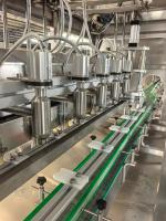 China Multi-head Servo Motor Digital Automatic Viscous Liquid Tracking Type Filling Machine for Car Lubricants Bottle 500ml 1000ml for sale