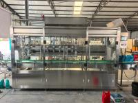 China 6 Nozzeles 4000BPH Servopump Automatic Lube Engine Oil Bottle Tracking Viscous Liquid Filling Machine with Conveyor for sale