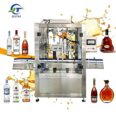 China Automatic Single Head Tracking Negative Pressure Filling Machine for Different Kinds of Wine Liquor Beverage Material Filling for sale
