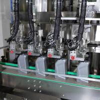 China Fully Automated 2000BPH Tracking Lubricant Engine Oil Thick Oil Filling Machine With Conveyor PLC Control for sale