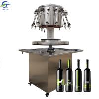 China Semi Automatic 12 Head Rotary Beverage Wine Alcohol Glass Bottle Liquid Filling Machine for sale