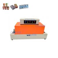 China Automatic desktop PVC POF PP plastic film tunnel food books tableware cosmetics box heat shrink packaging machine for sale